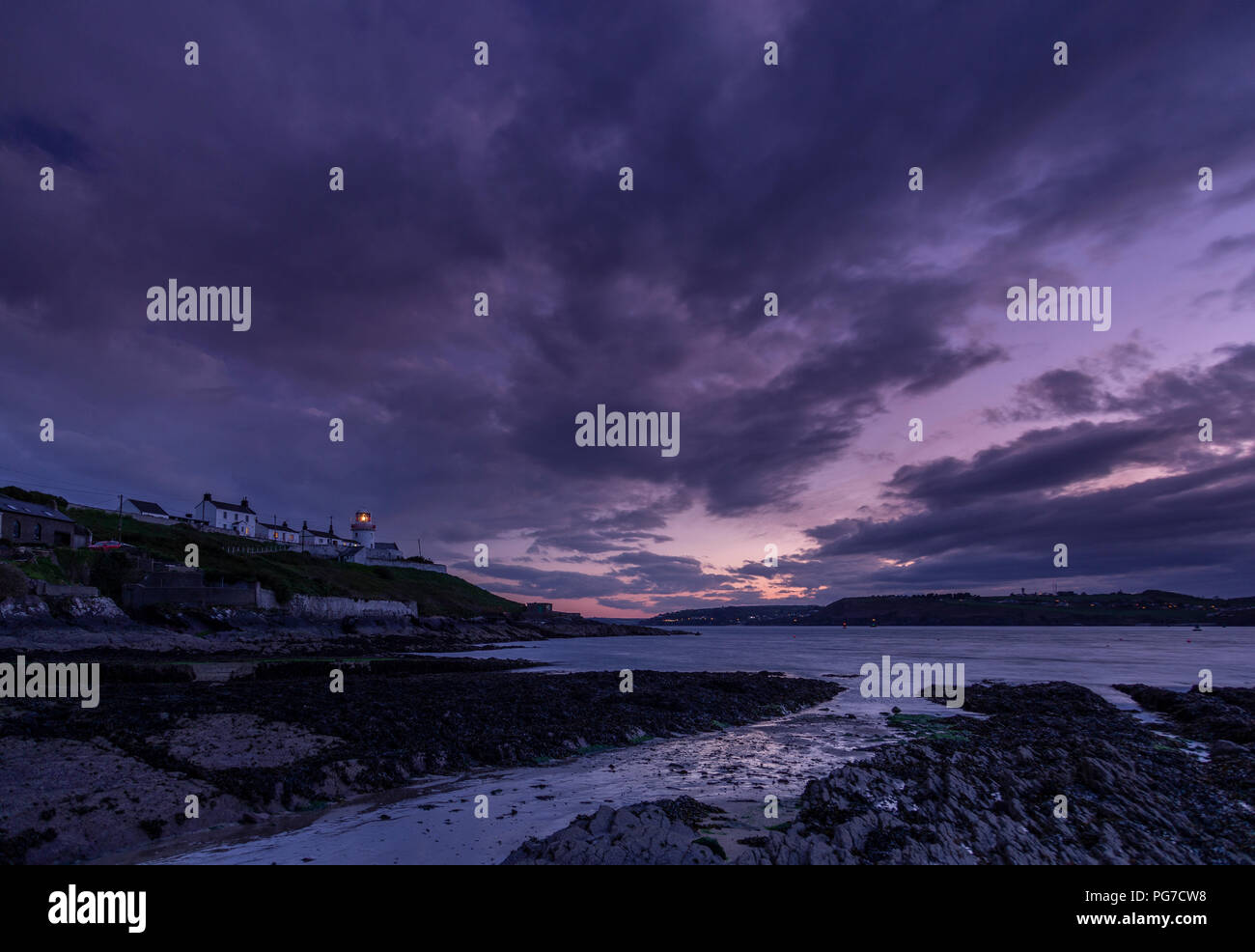 Lighthouse at Roches Point on the south coast of Ireland Stock Photo ...
