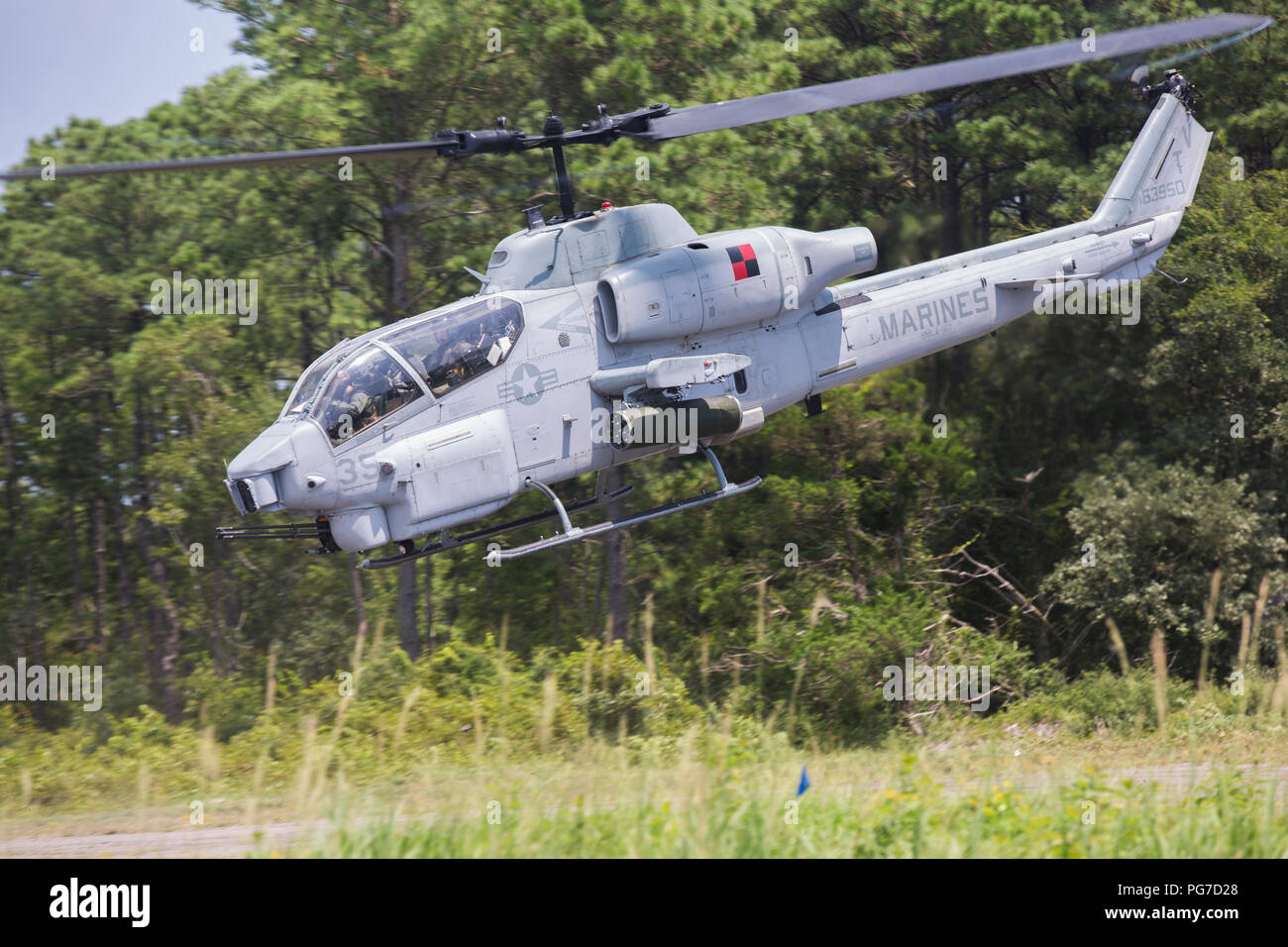 A U.S. Marine Corps AH-1W Super Cobra with Marine Light Attack ...