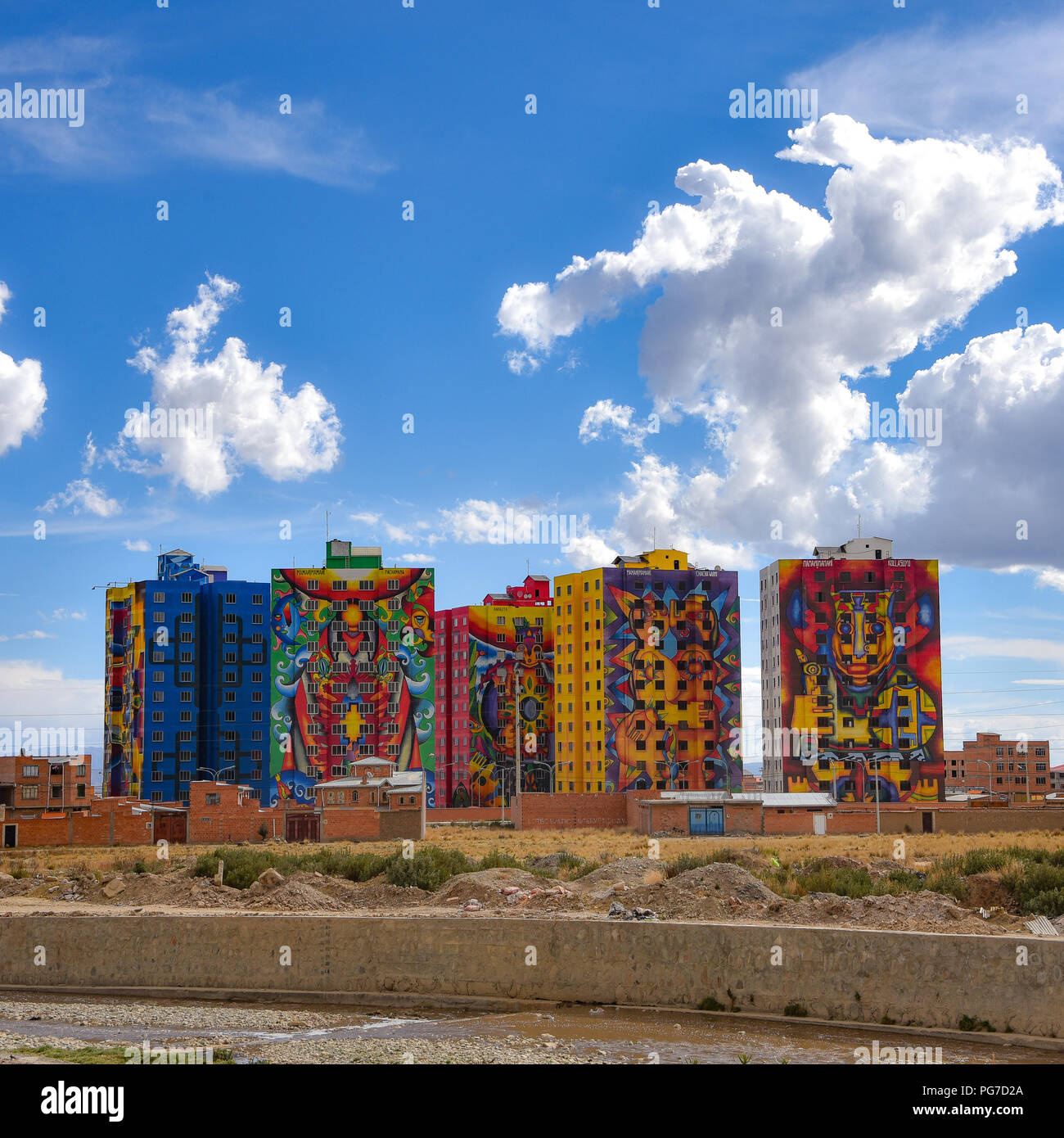Brightly colored murals painted by Bolivian artist Roberto Mamani ...