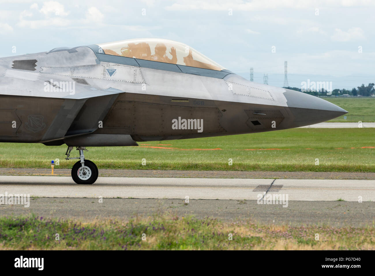 An F-22 Raptor Demonstration Team pilot taxis down the runway before a ...