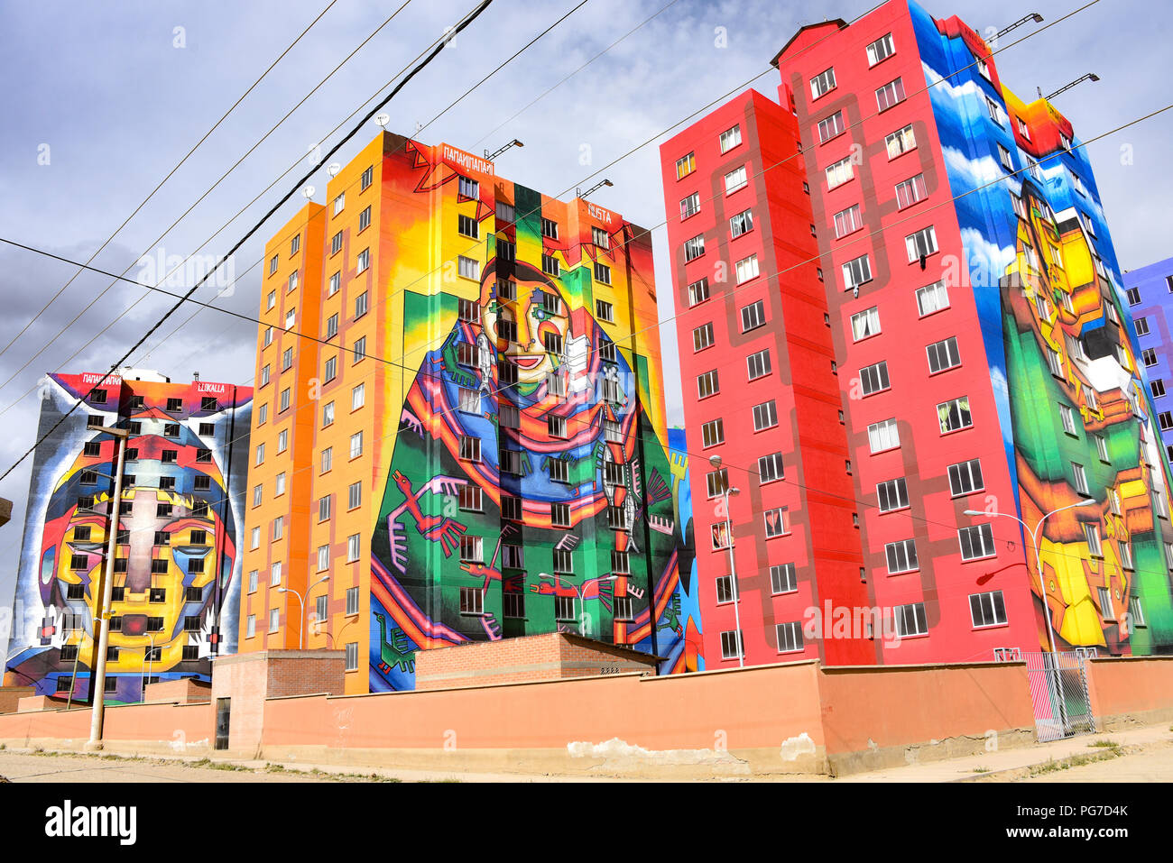Brightly colored murals painted by Bolivian artist Roberto Mamani ...