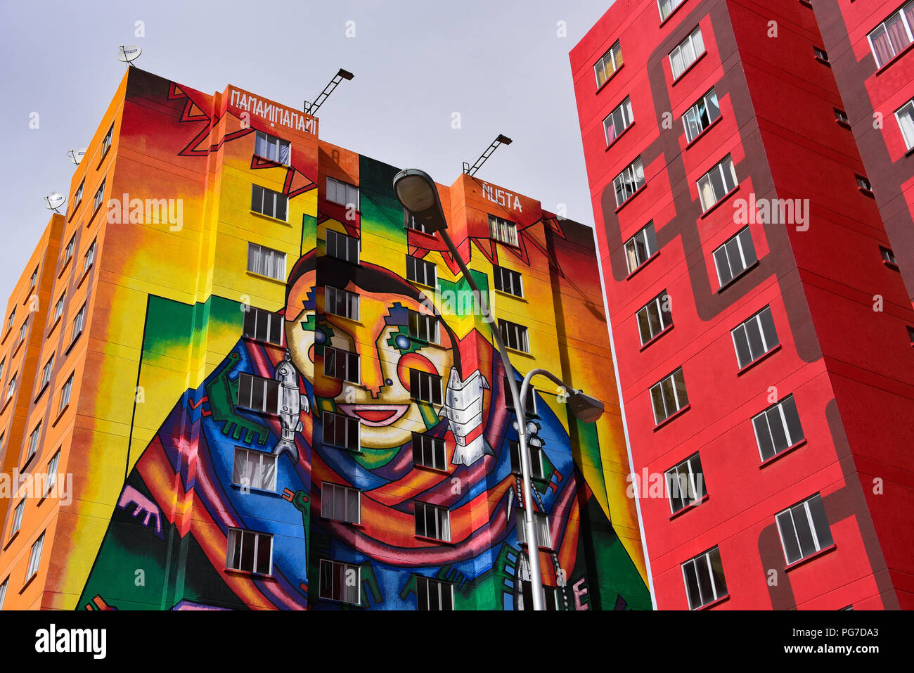 Brightly colored murals painted by Bolivian artist Roberto Mamani ...