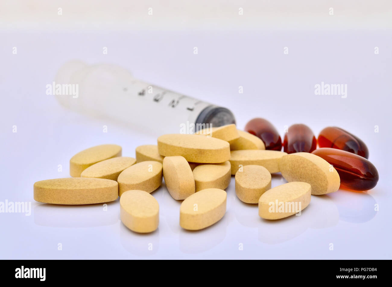 Many drug and syring on white background Stock Photo - Alamy