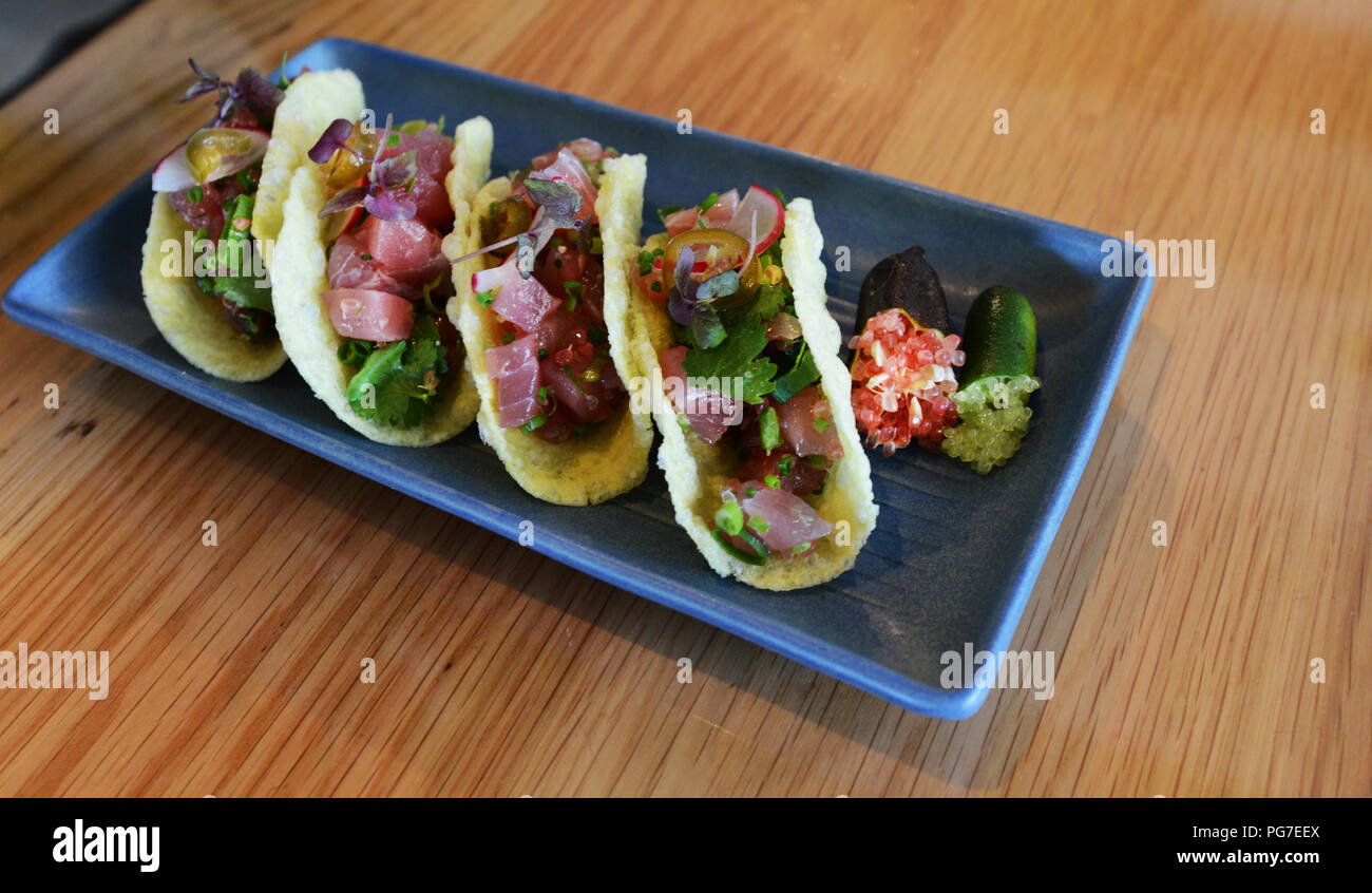 Tuna Sashimi taco with finger lime garish Stock Photo - Alamy