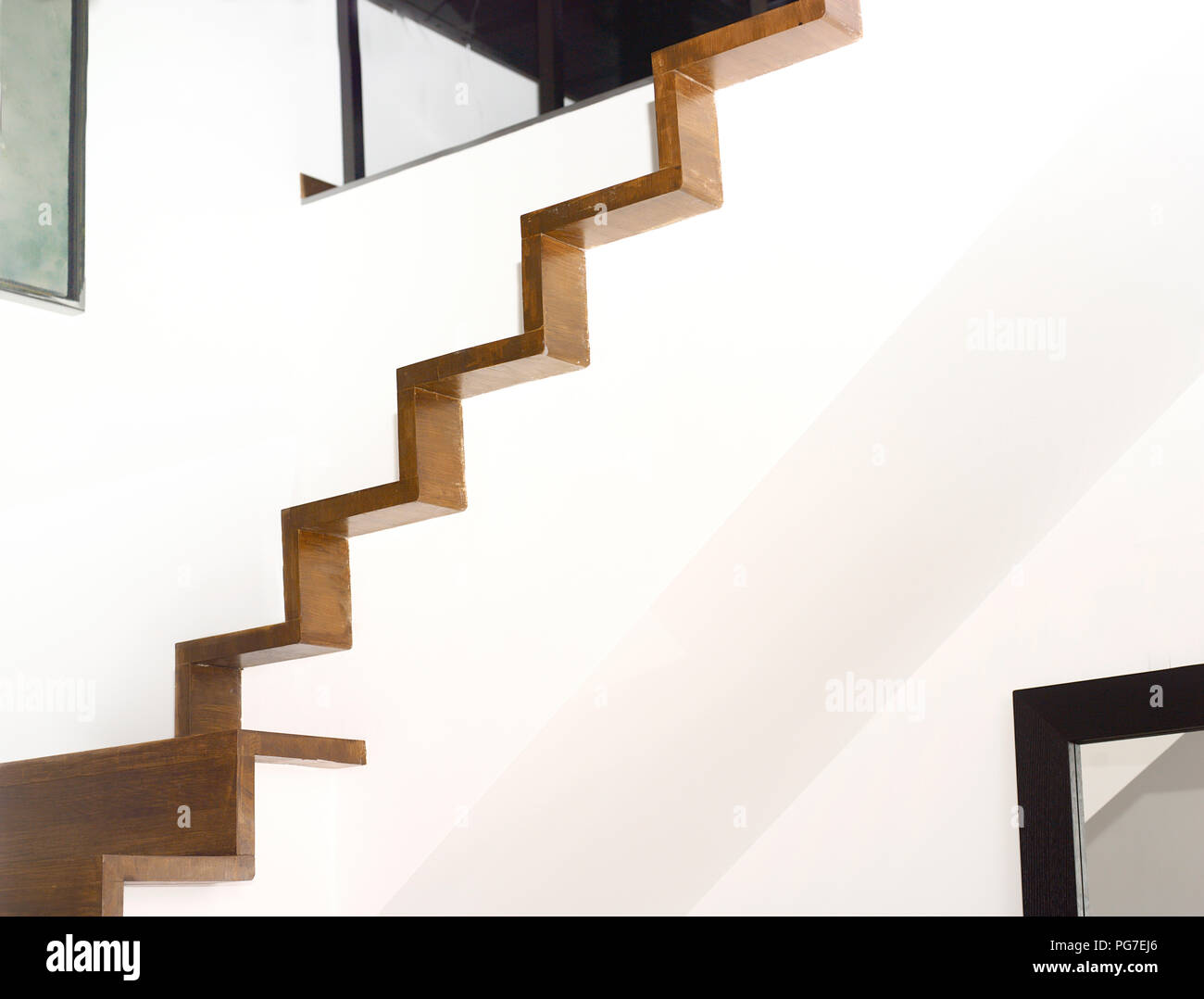 Interior of a modern house with staircase without handrails, cropped ...