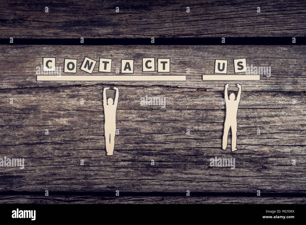 Business team Contact Us concept with cut outs of two paper men ...