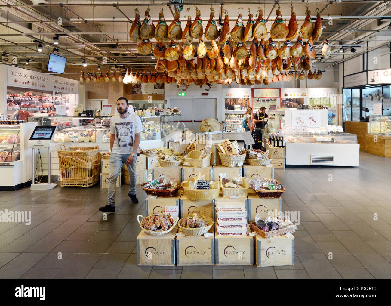 Italian Ham on display in Eataly in Rome's Ostiense station Stock Photo ...