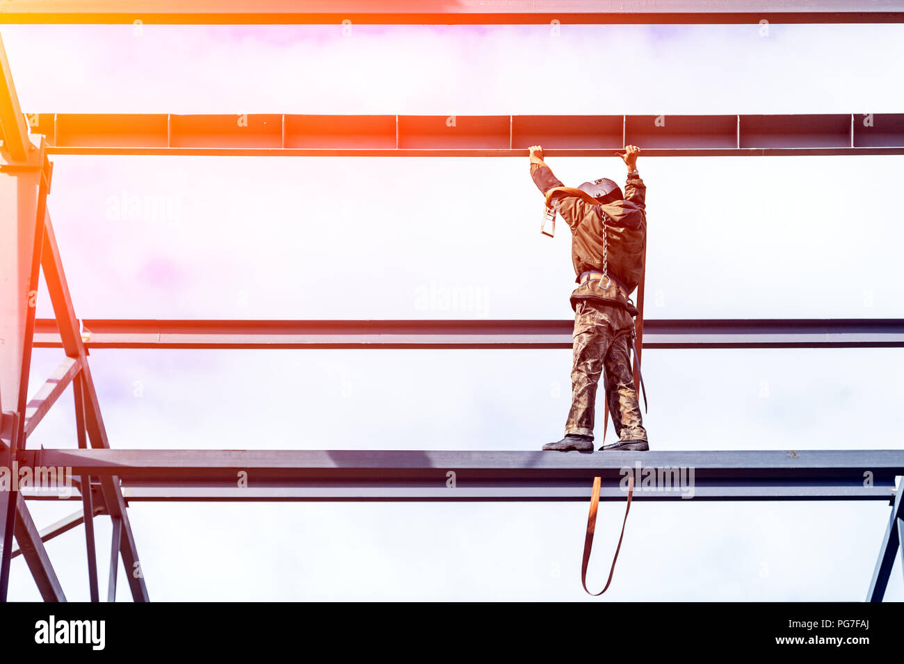 A man builder in a construction uniform without insurance moves around ...