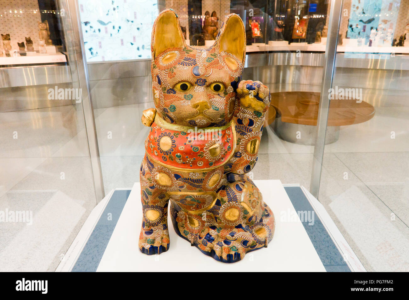 Mikawa style Maneki neko (Japanese ceramic "beckoning cat Stock Photo ...