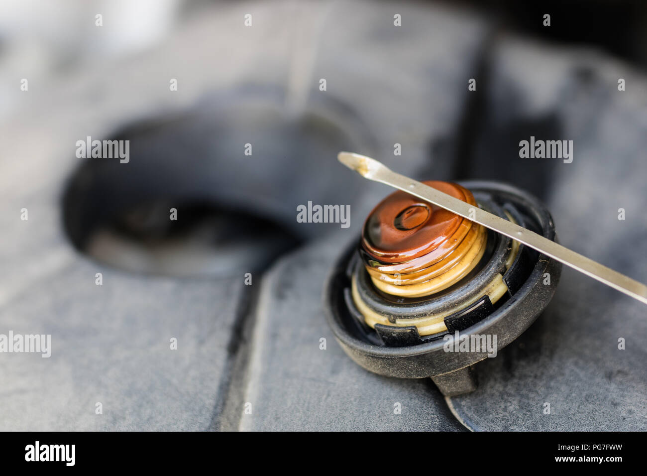 Oil filler for the car engine. Replenishing liquids in the drive unit ...