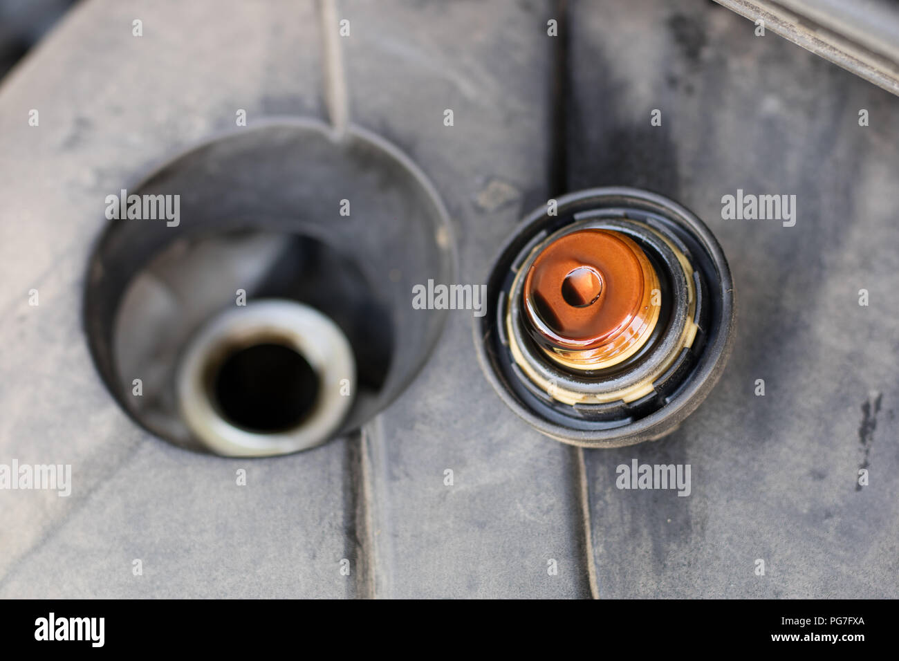 Oil filler for the car engine. Replenishing liquids in the drive unit ...