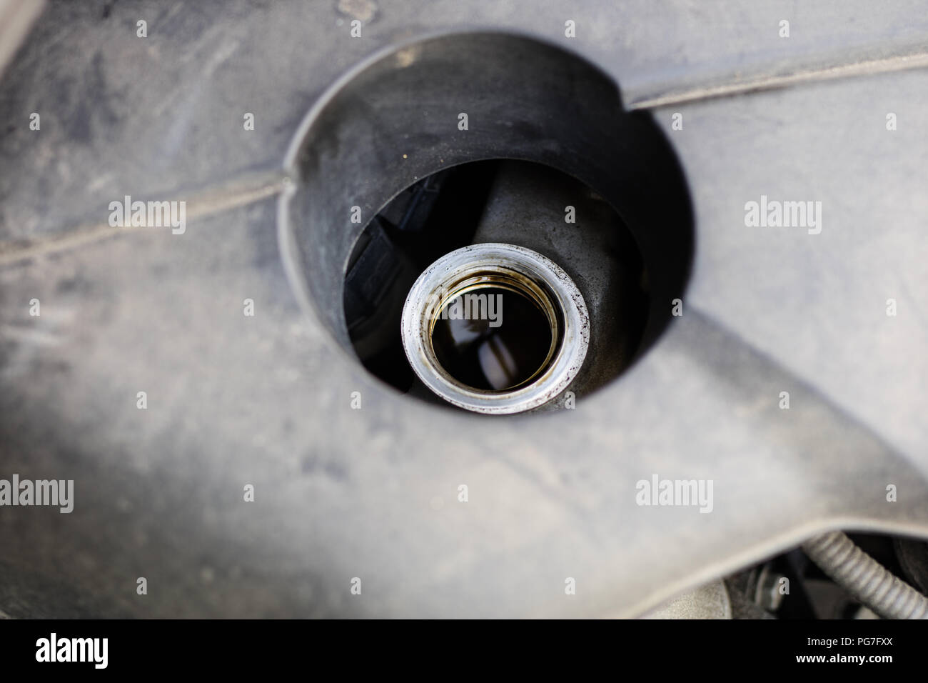 Oil filler for the car engine. Replenishing liquids in the drive unit ...
