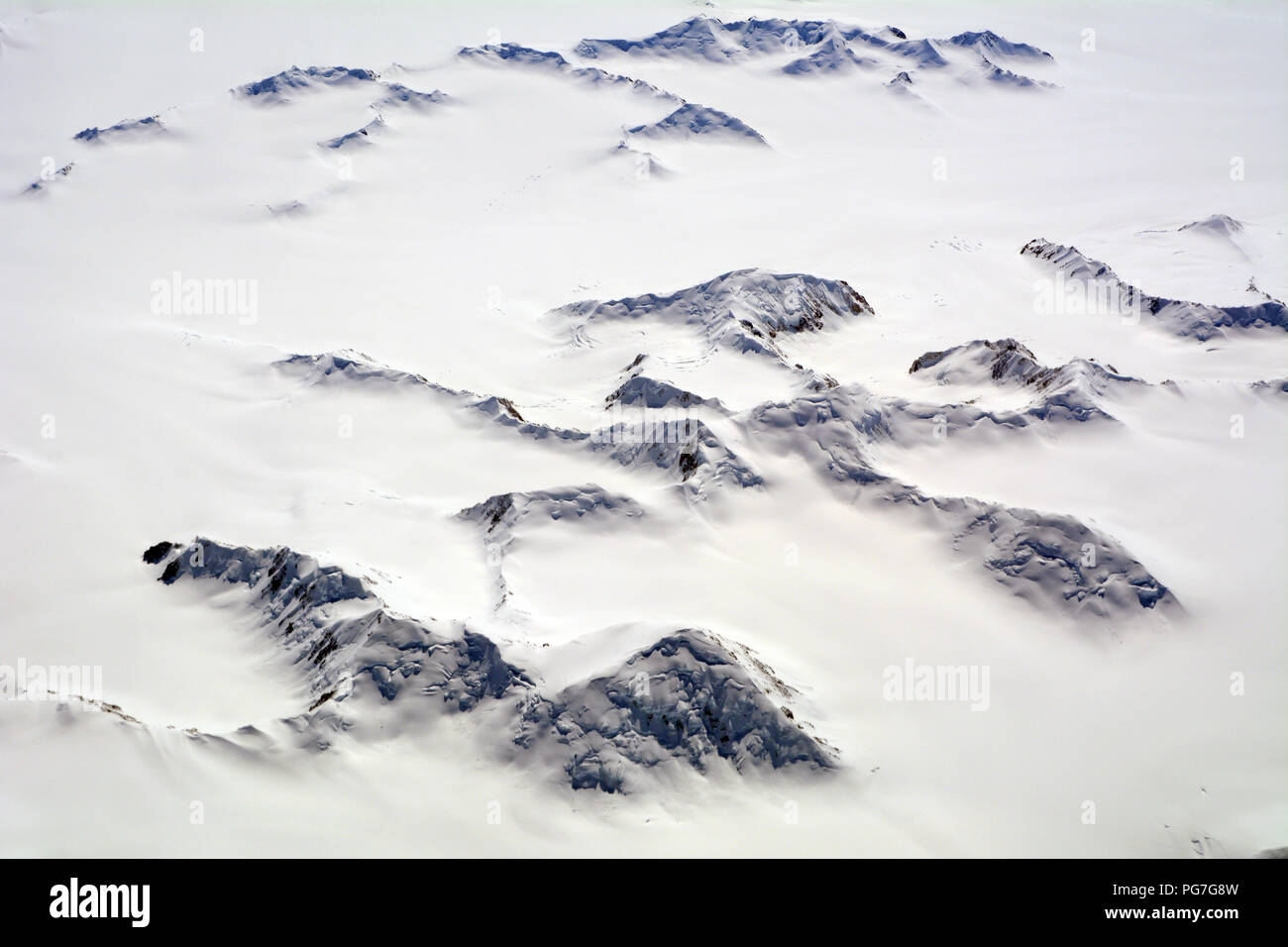 Aerials of nunataks (mountaintops poking out of glaciers) in the ...
