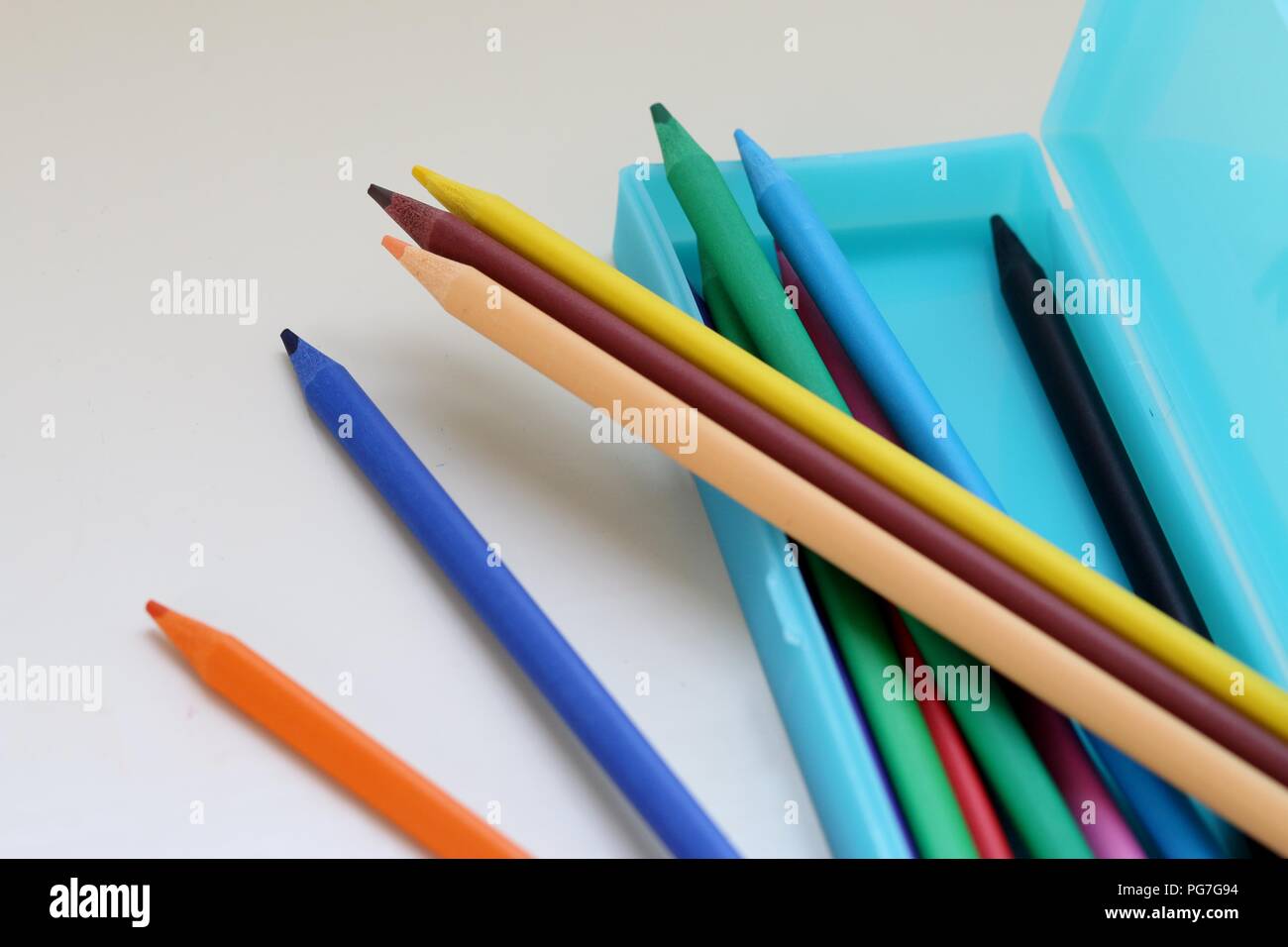Colored pencils in a light blue pencil case Stock Photo - Alamy