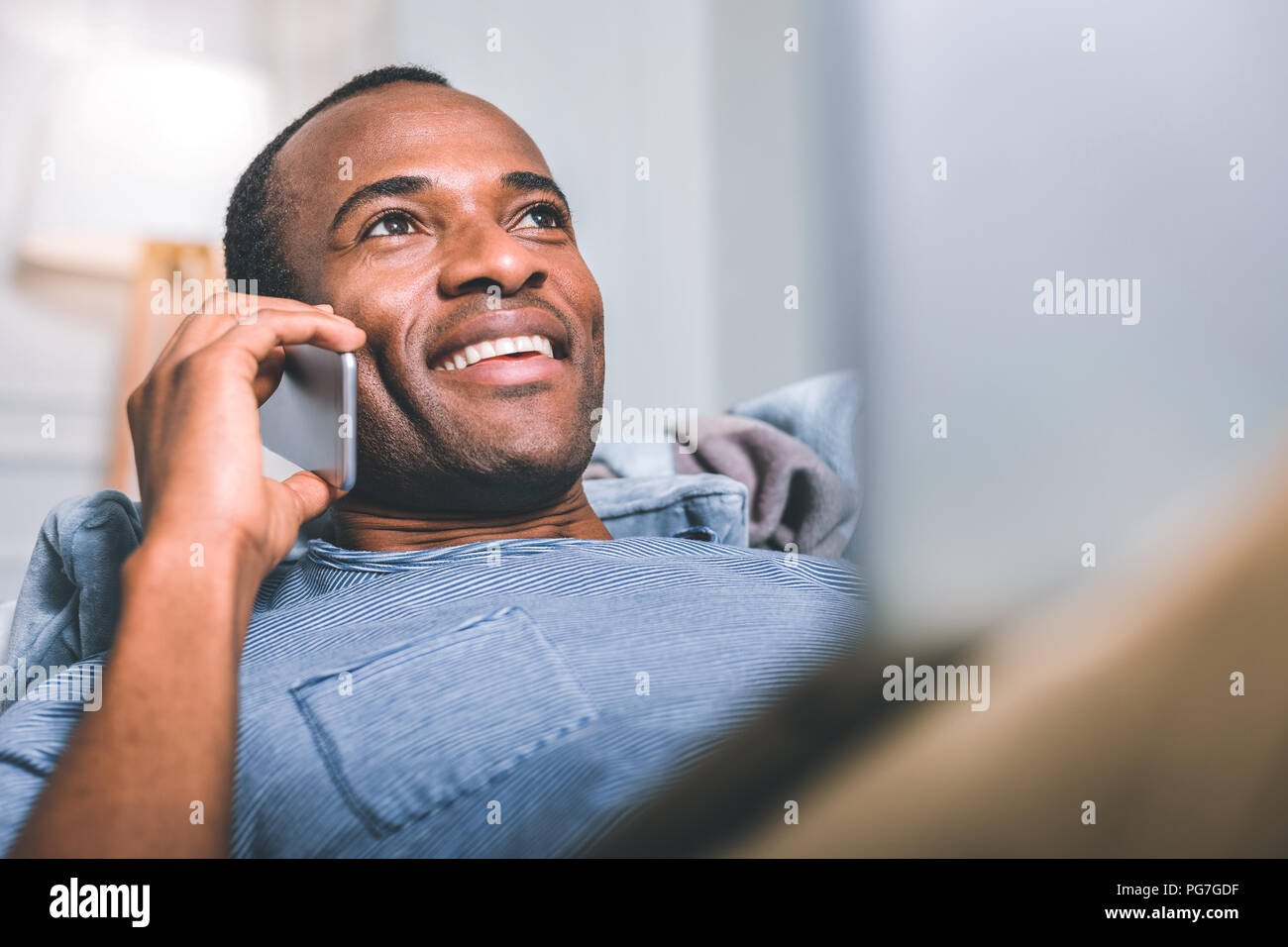 Excited man speaking on the phone Stock Photo - Alamy