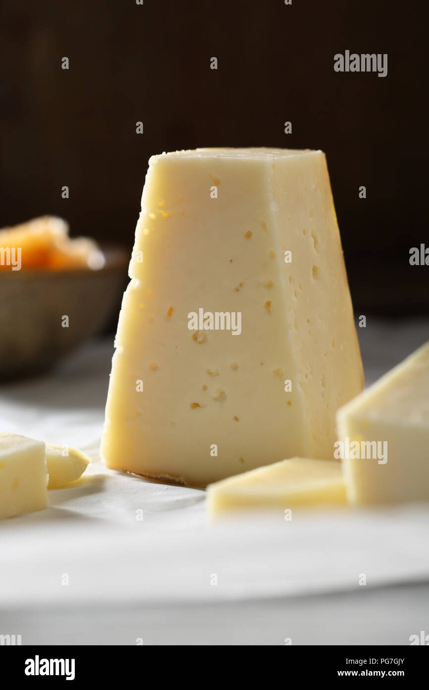 One piece of natural cheese, food close-up Stock Photo - Alamy