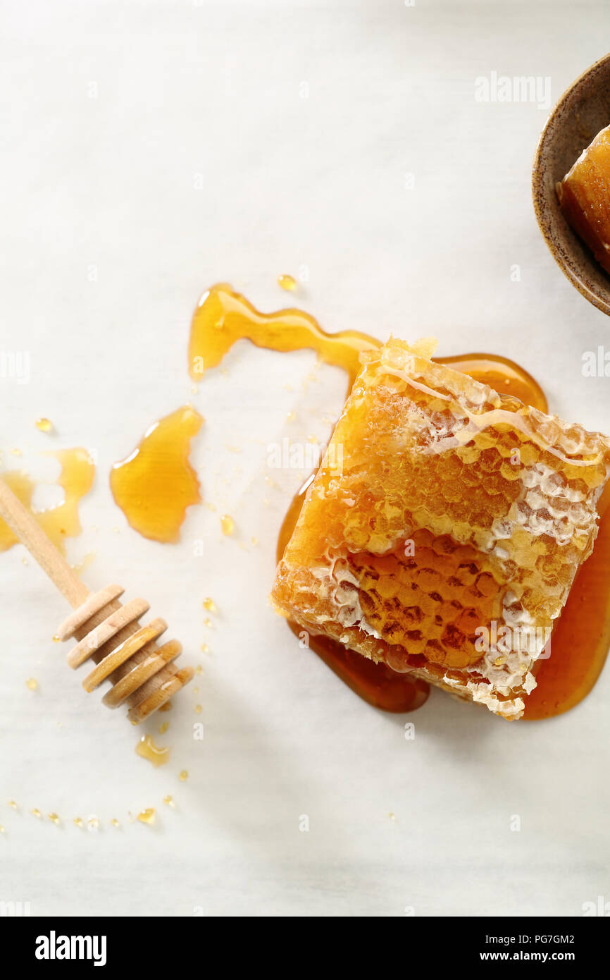 Fresh honeycomb and stick top view Stock Photo - Alamy