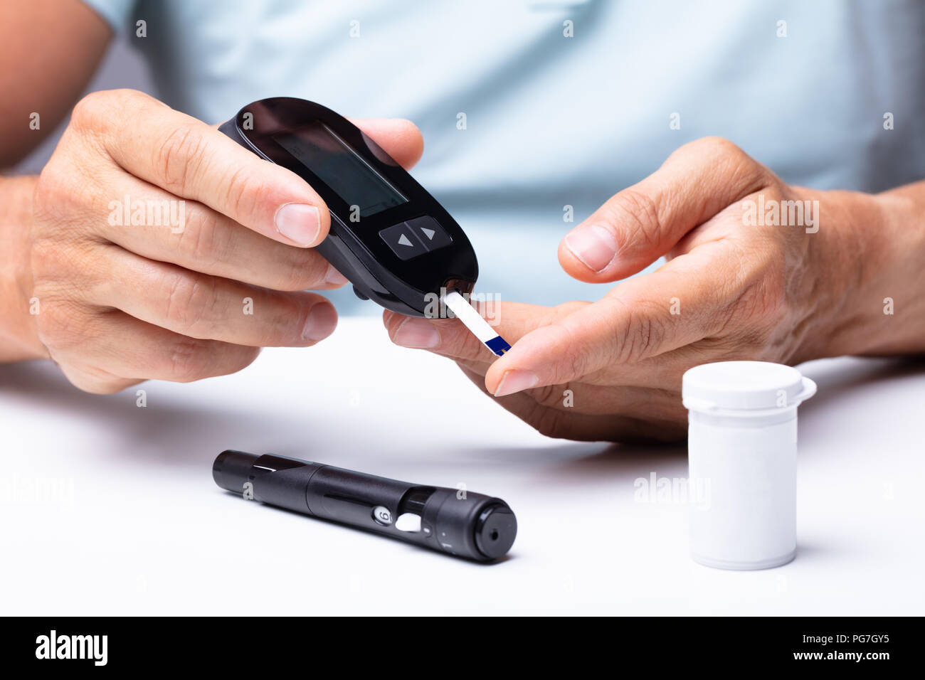 Close-up Of A Man's Hand Checking Blood Sugar Level With Glucometer ...
