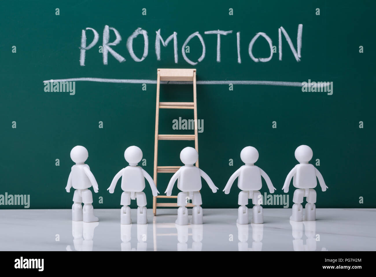 Miniature figures on ladder hi-res stock photography and images - Alamy