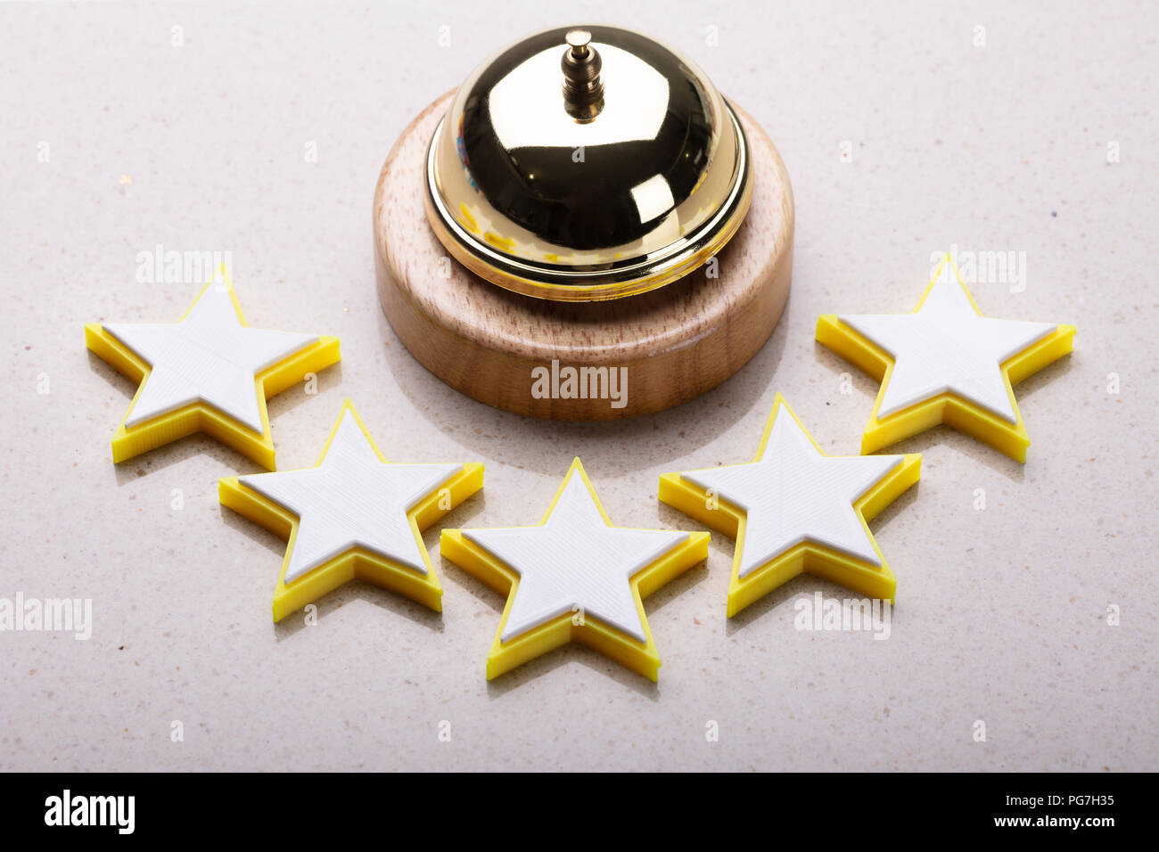Elevated View Of Service Bell And Five Star Rating Icon On Reception ...