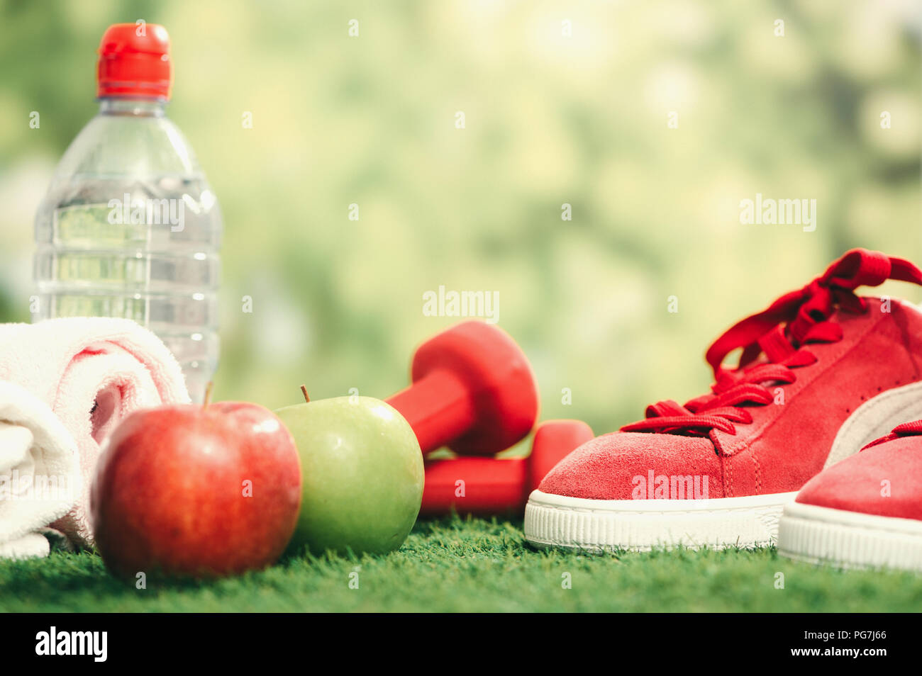 fitness concept with Exercise Equipment on green grass background Stock ...