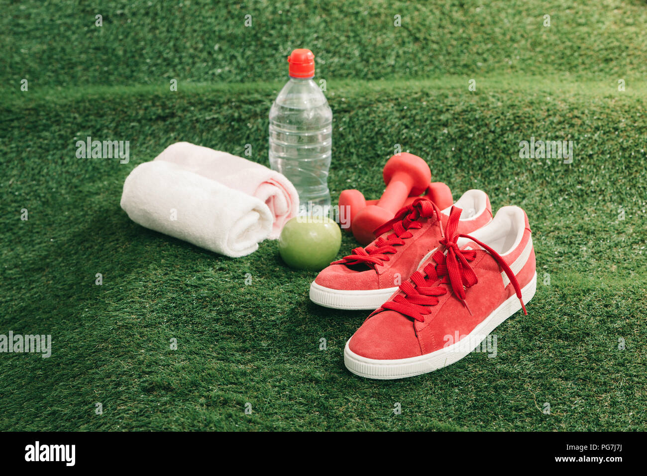 fitness concept with Exercise Equipment on green grass background Stock ...