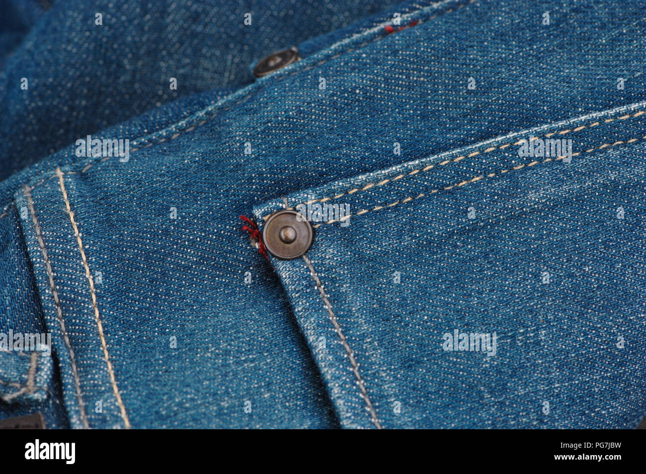 part of the blue denim pants with pockets and rivets, close-up Stock ...