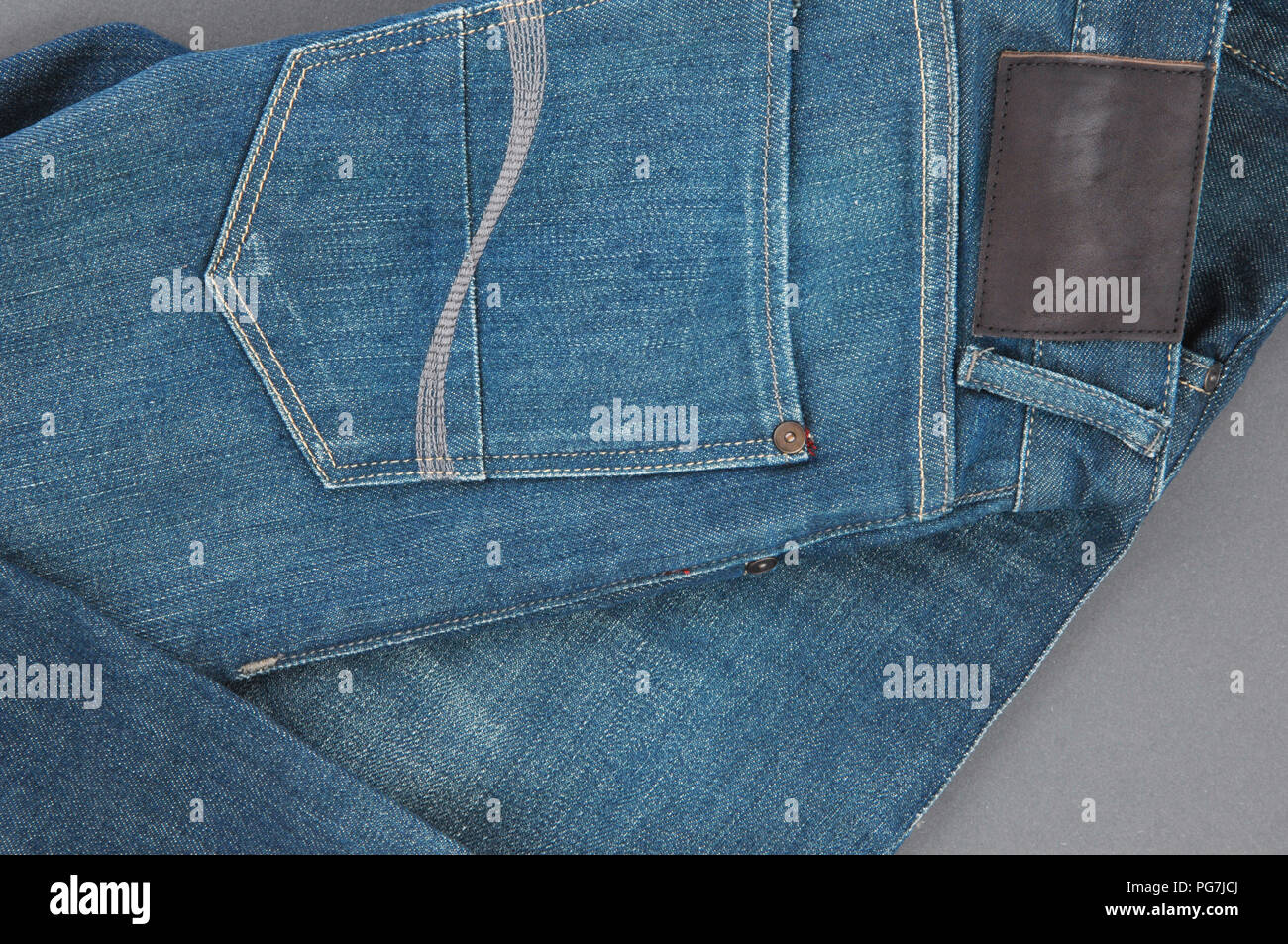 part of denim pants with back pockets and label, close-up Stock Photo ...