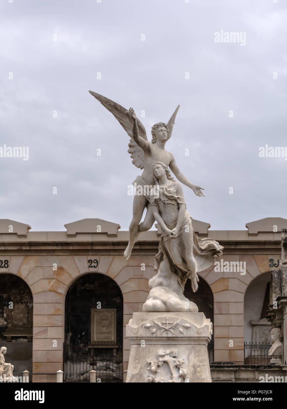Neoclassic sculpture of a winged angel raising the swooning soul of a ...