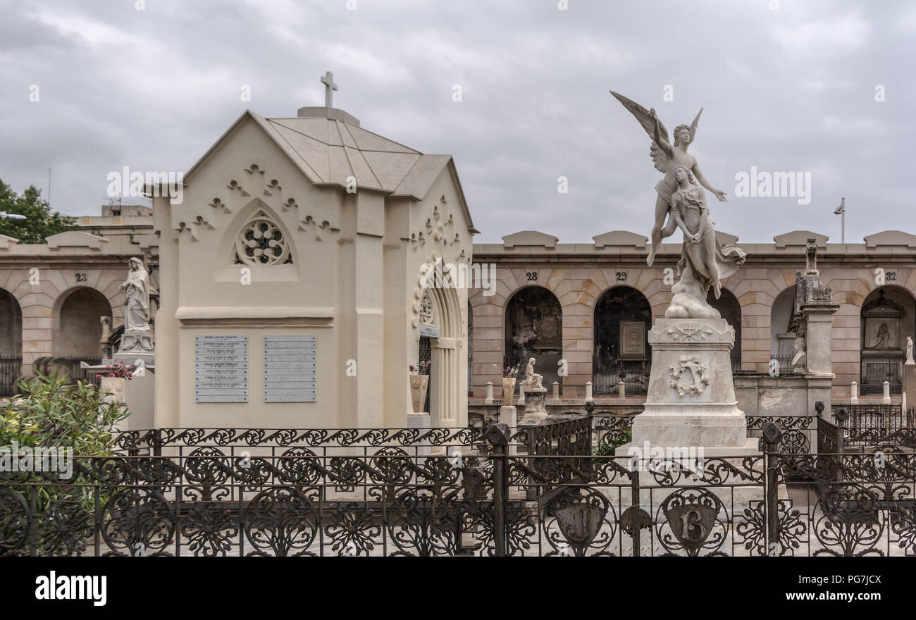 Crypts and sculptures on graves in Poblenou Cemetery. Peaceful but ...
