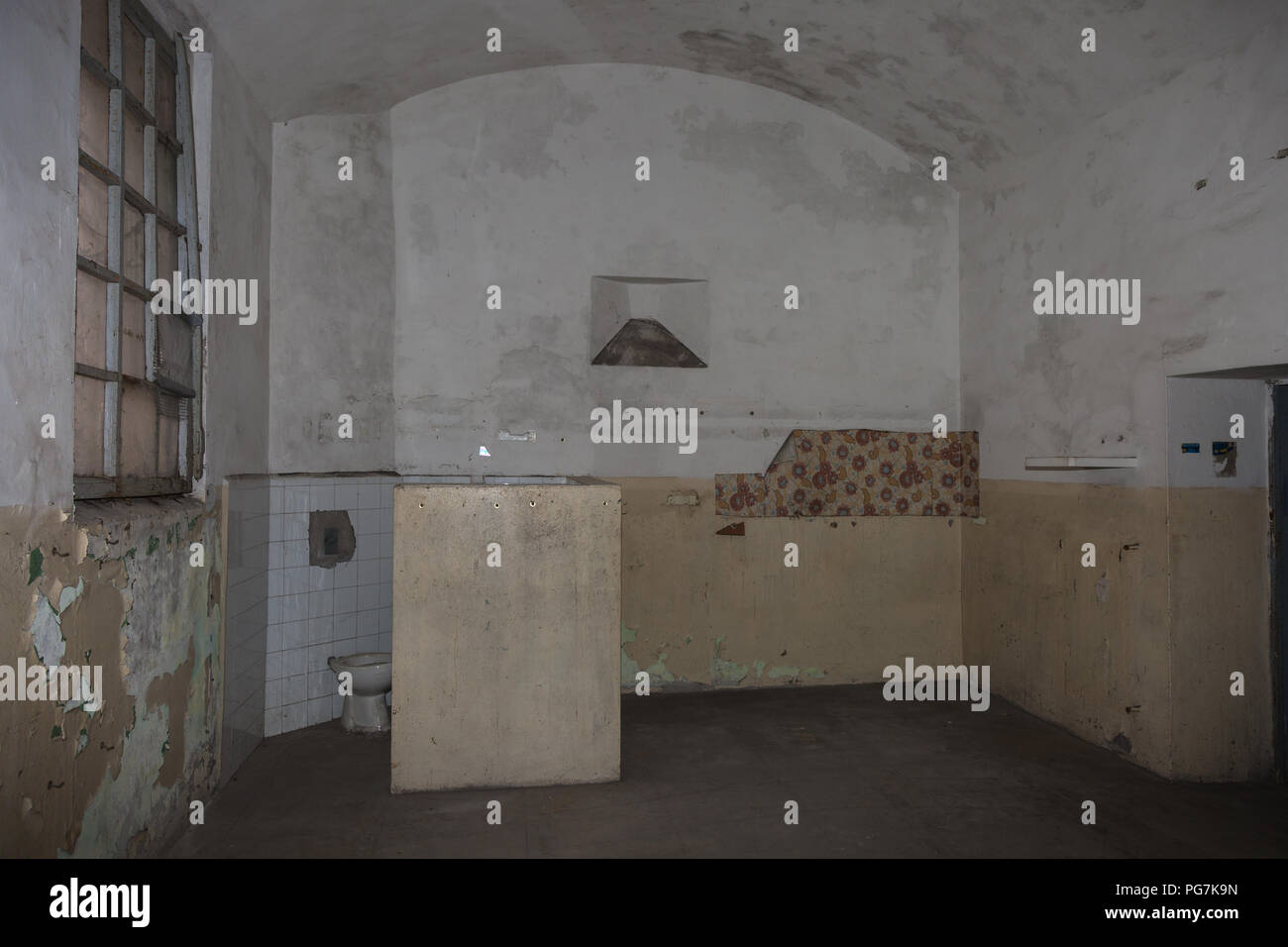 Empty Room with a Toilet in an Old Prison Stock Photo - Alamy