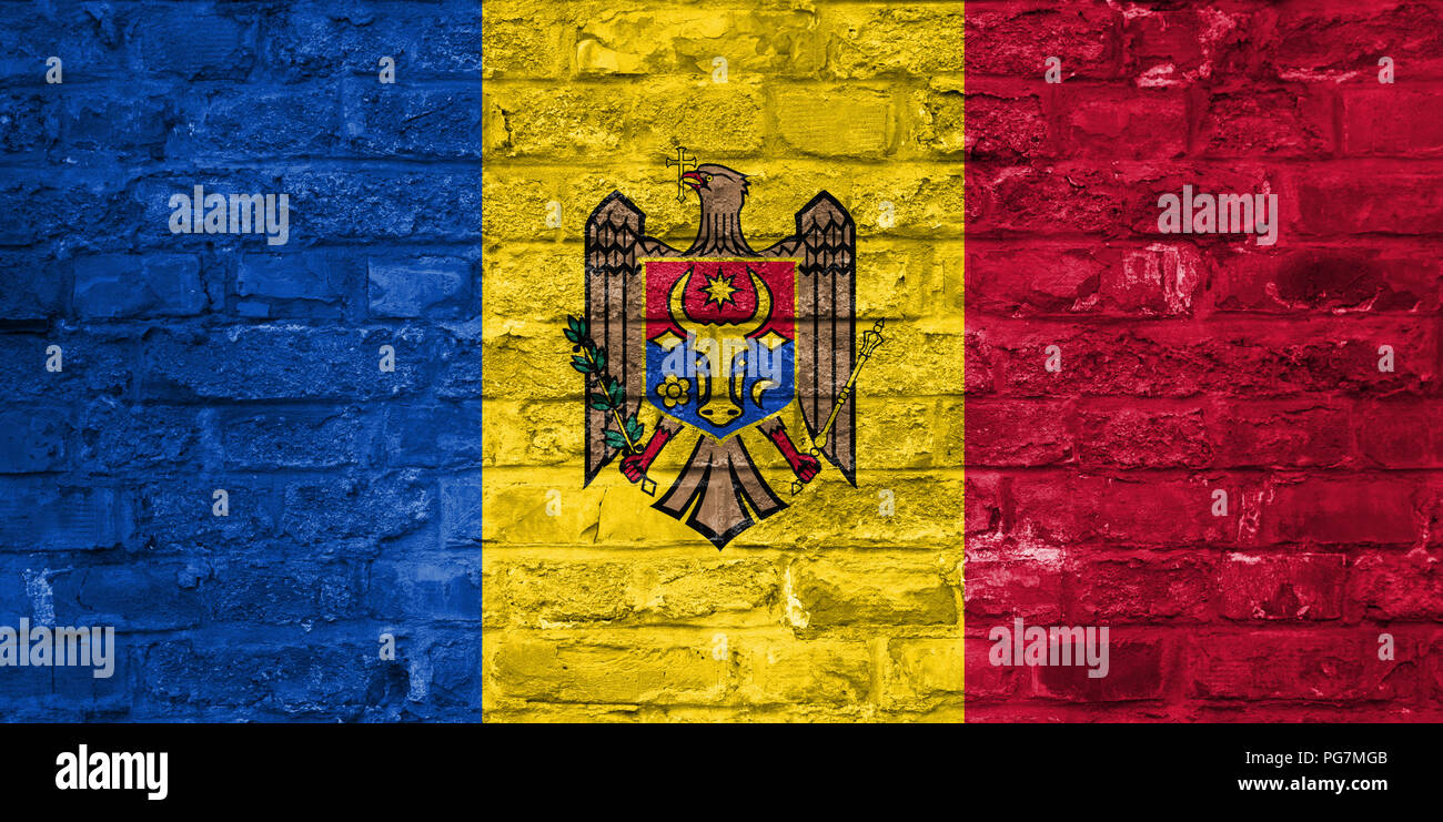 Flag of Moldova over an old brick wall background, surface Stock Photo ...