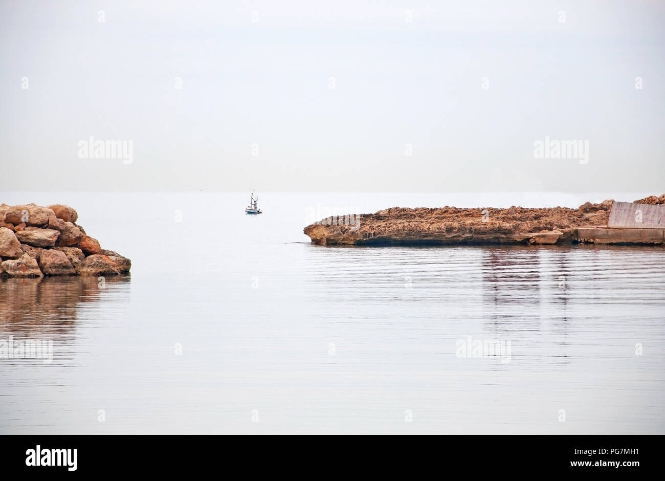 Fishing boat in the mist hi-res stock photography and images - Alamy