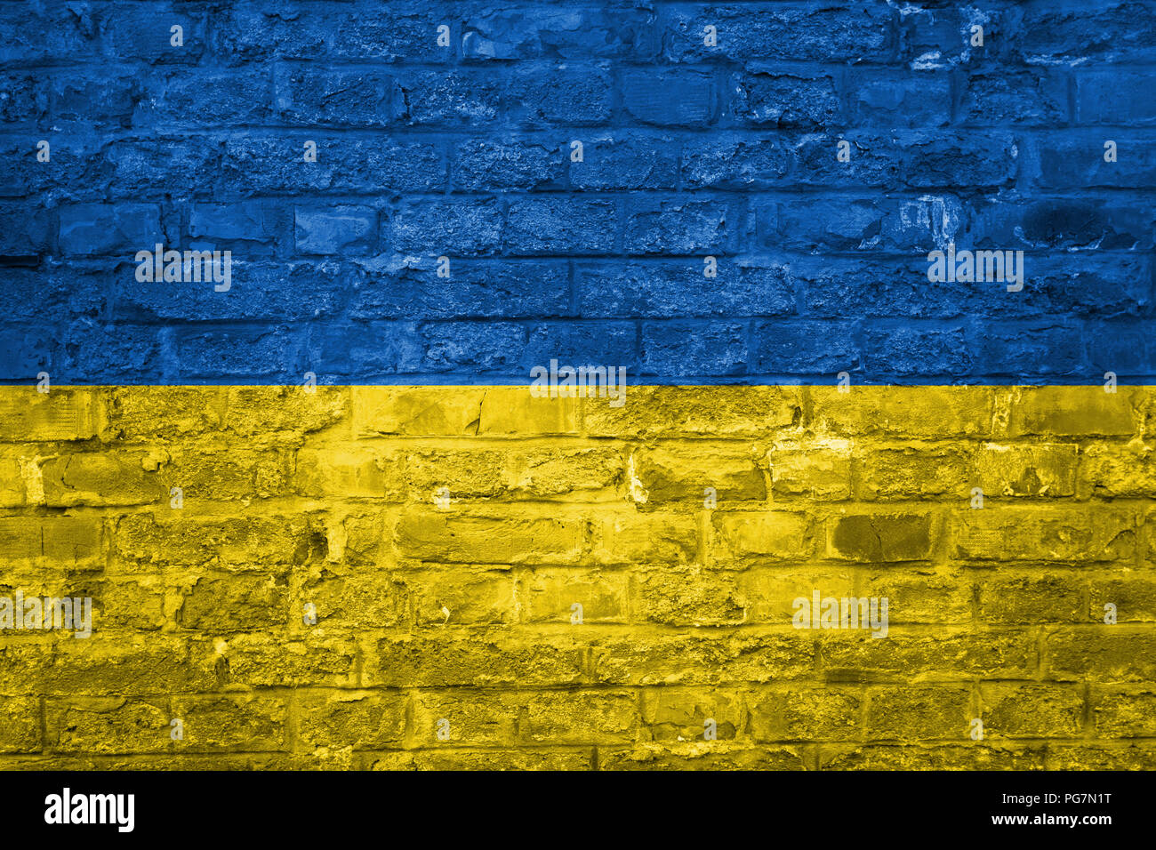 Flag of Ukraine over an old brick wall background, surface Stock Photo ...