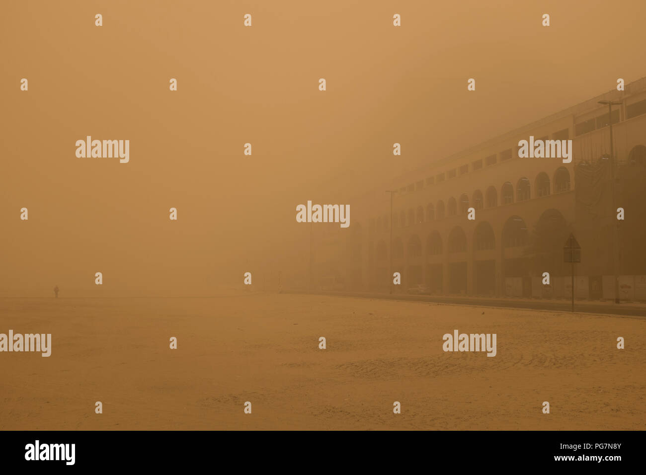 Man walking in the Al Barsha district of Dubai, United Arab Emirates ...