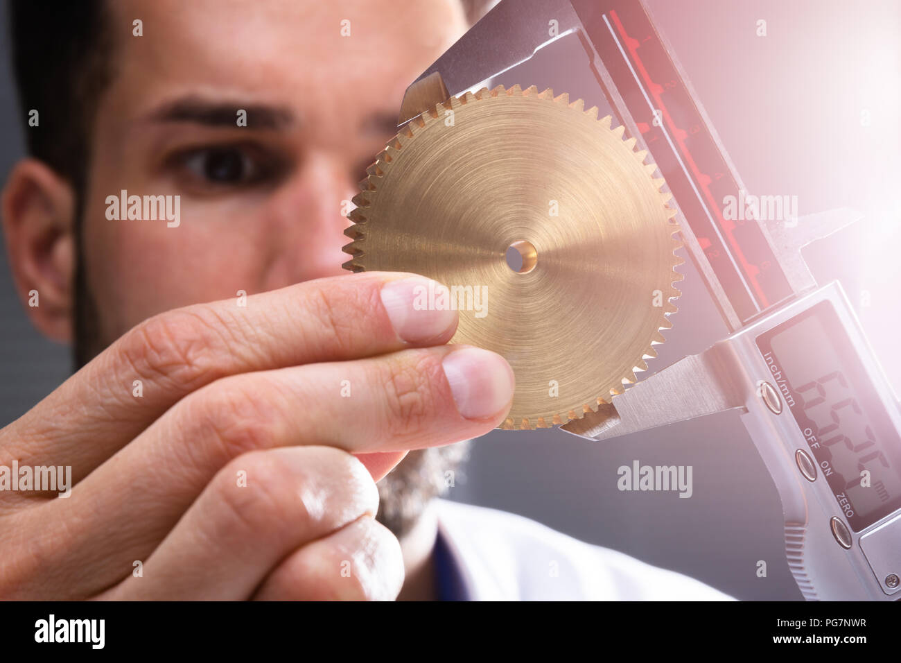 Close-up Of A Man's Hand Measuring Gear's Size With Digital Electronic ...