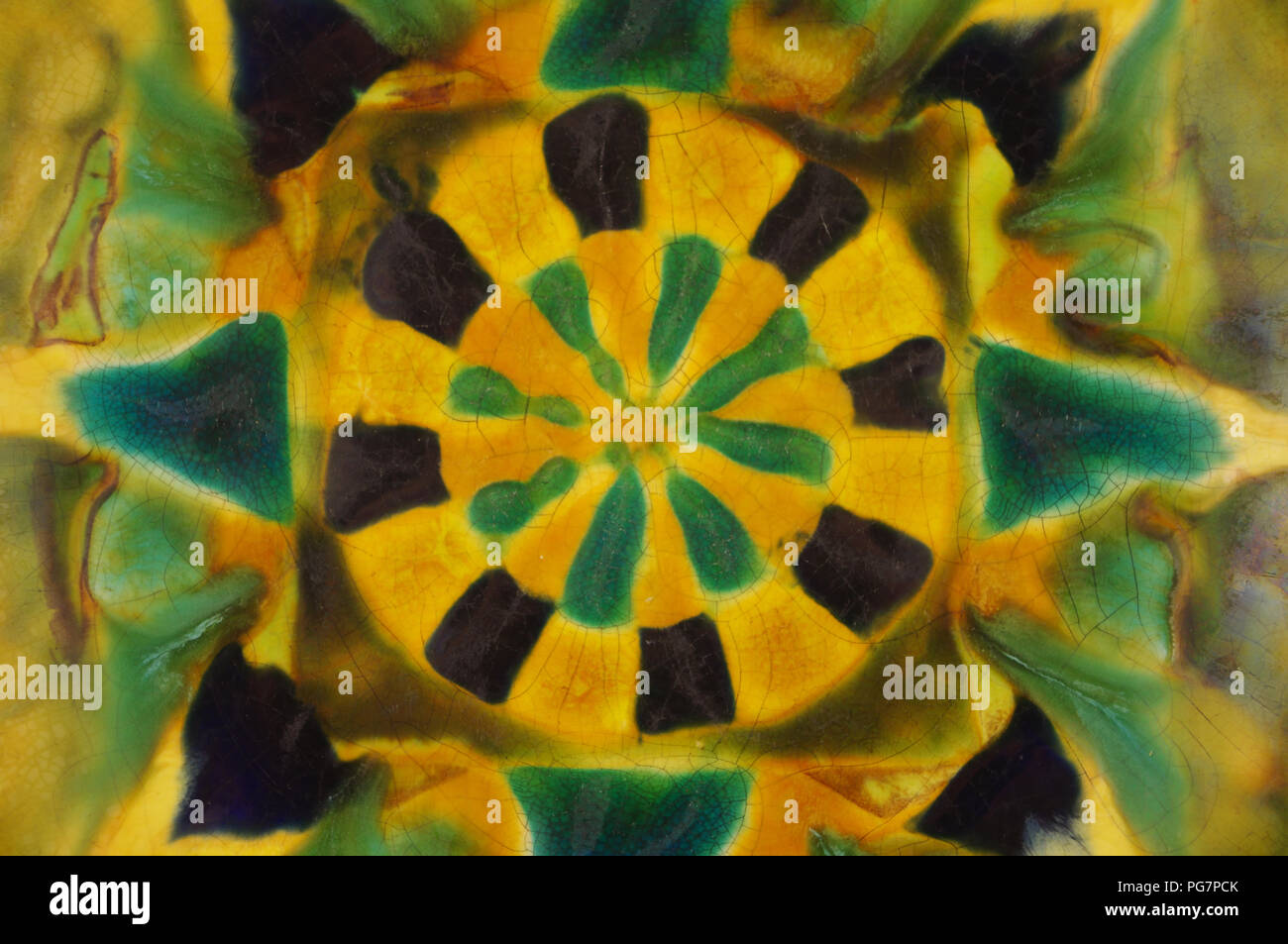 Painting of a rosette in green, blue and brown tones Stock Photo - Alamy