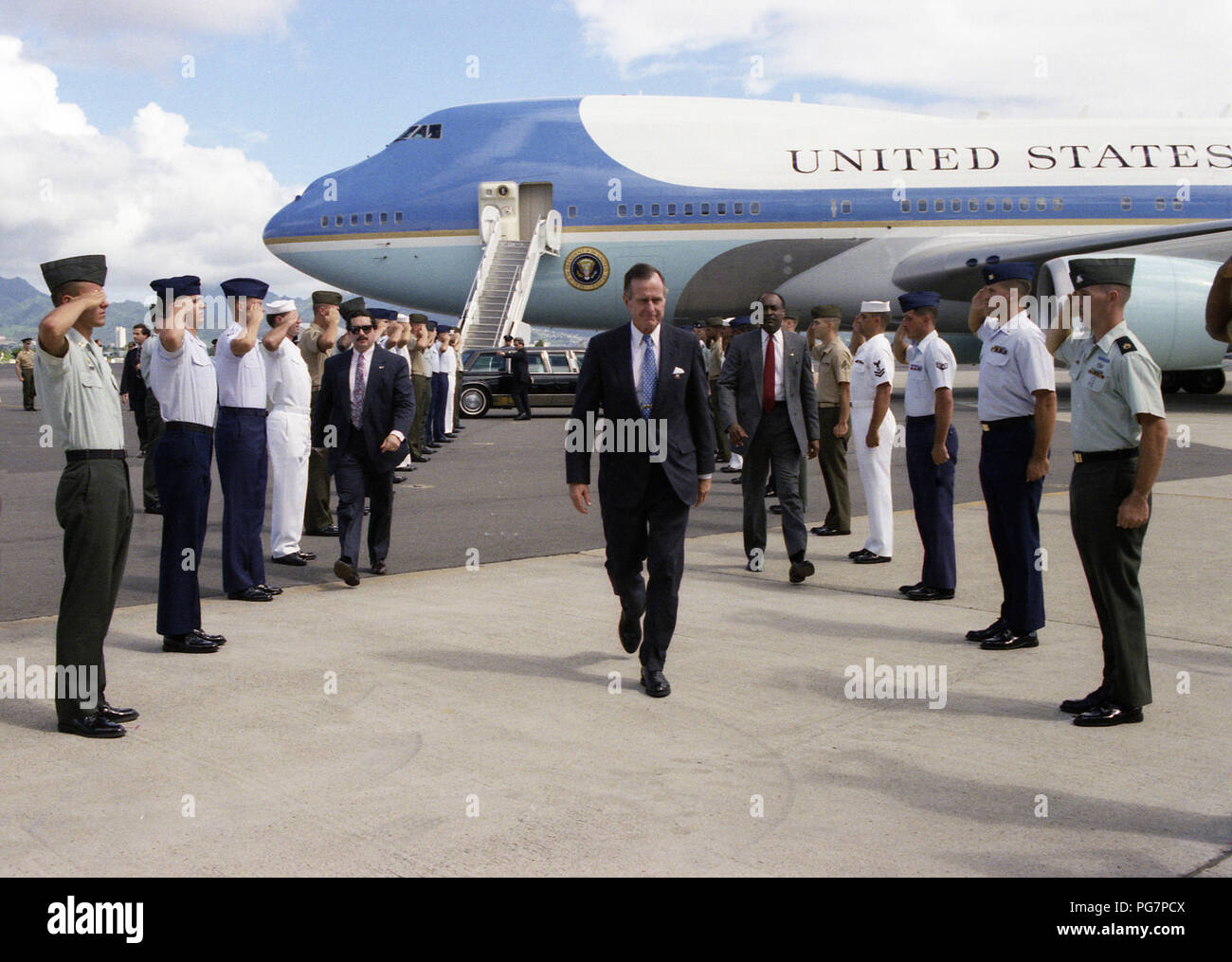 Upon deplaning Air Force One, President Bush is welcomed by military ...