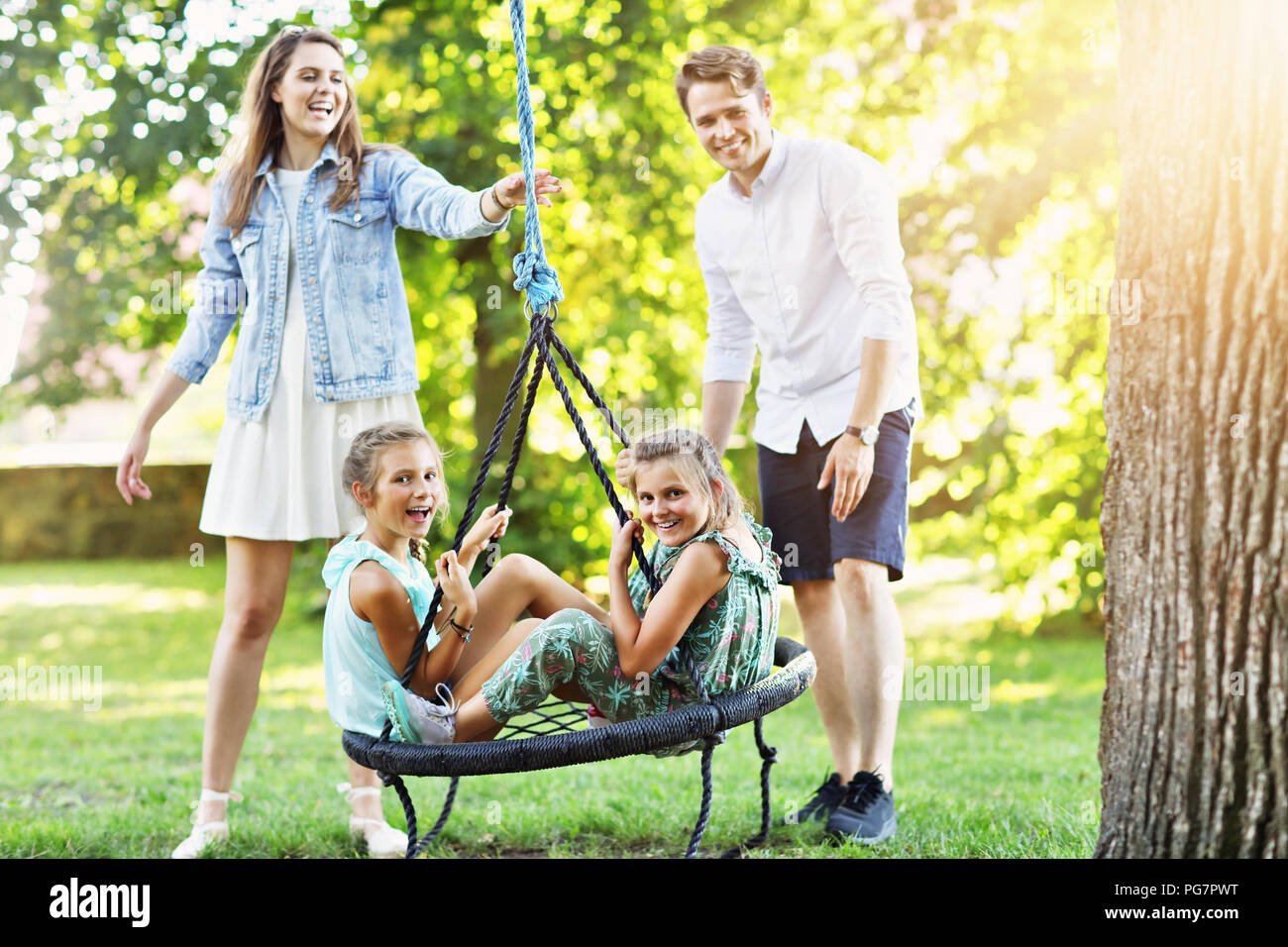 Picture showing joyful family having fun on playground Stock Photo - Alamy