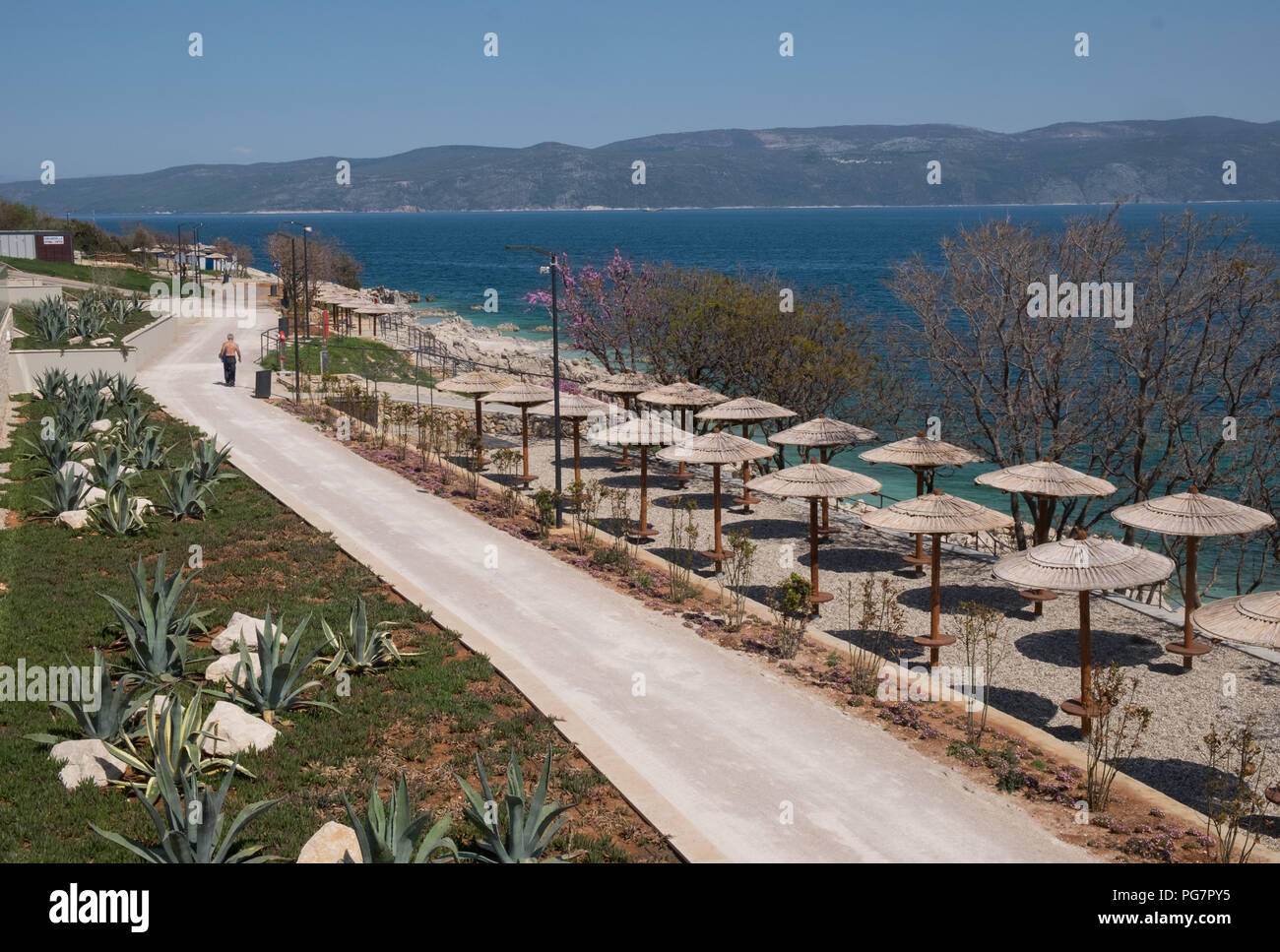 Elderly man walking along the seafront, Rabac, Istria, Croatia,Europe ...