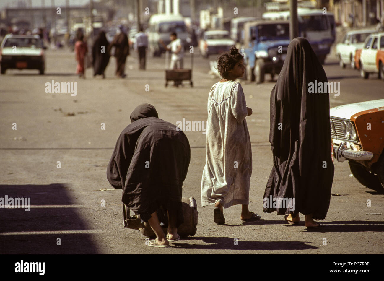 Baghdad, Iraq - October 1995 - An elderly Iraqi woman rolls a butane ...