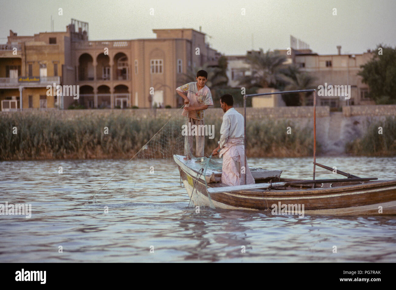 Fishing on the Tigris River in central Baghdad near the Republic Bridge ...