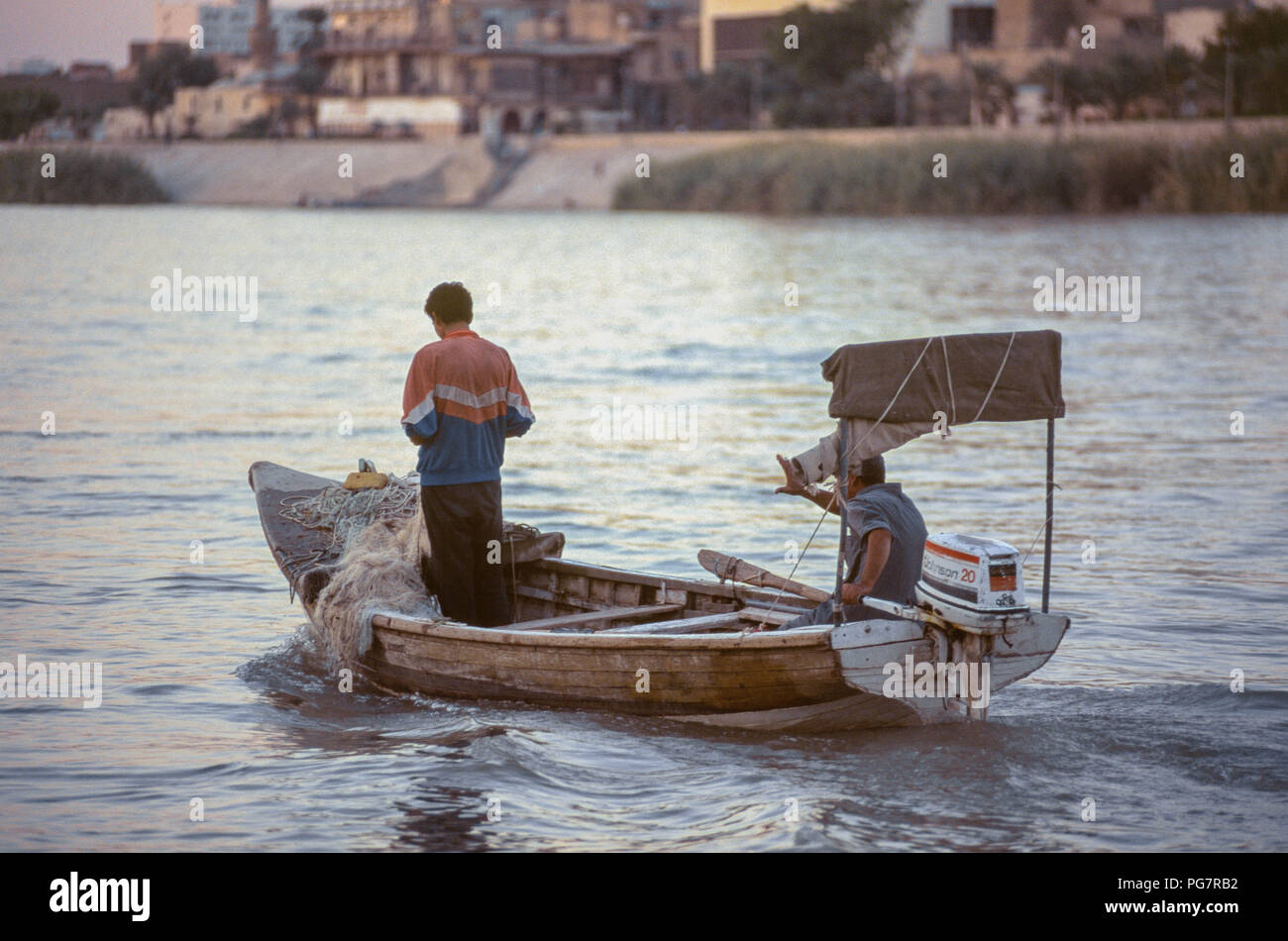Fishing on the Tigris River in central Baghdad near the Republic Bridge ...