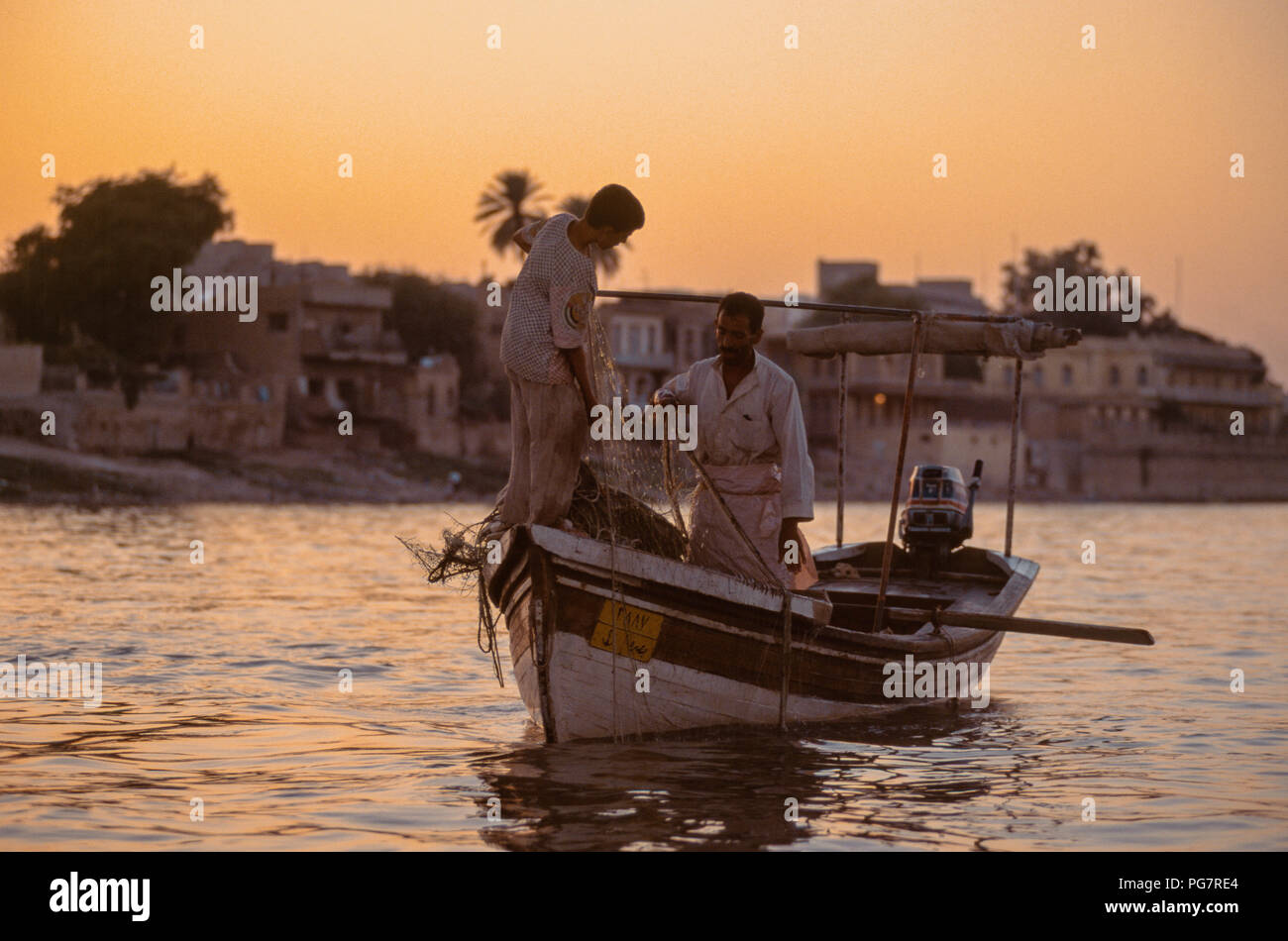 Fishing on the Tigris River in central Baghdad near the Republic Bridge ...