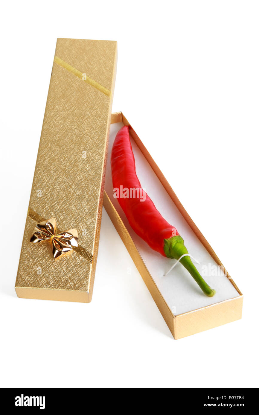 Christmas and New Year gift with red chile isolated on the white ...