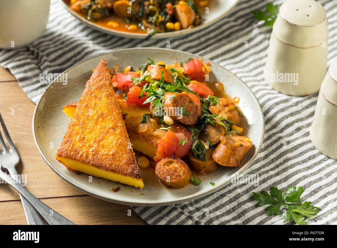 Fried Polenta with Sausage Stew Ready to Eat Stock Photo - Alamy