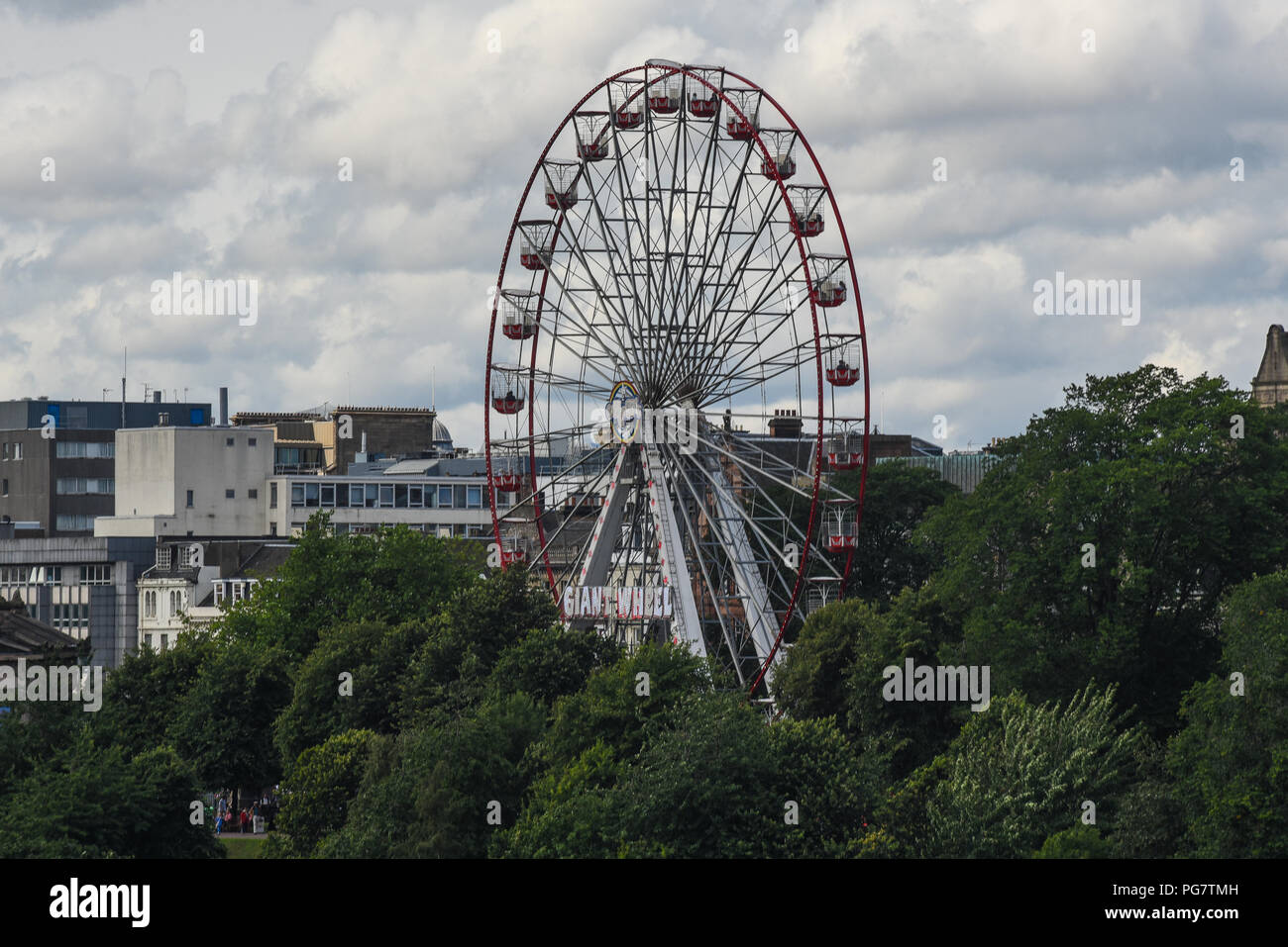 The ferris wheel in the center of Edinburgh, Scotland.Different ...