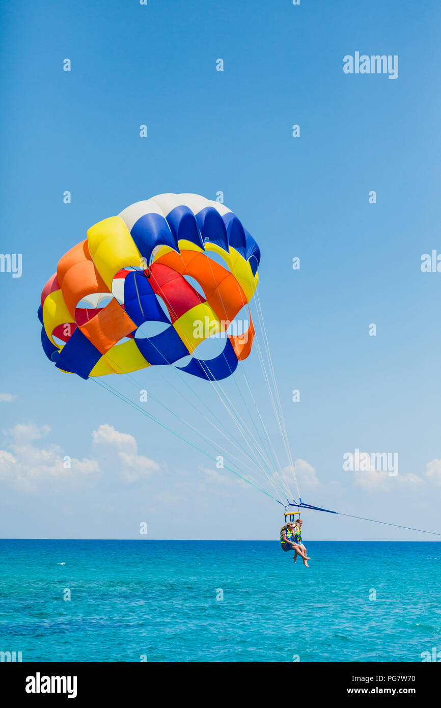 Parasailing water amusement - flying on a parachute behind a boat on a ...