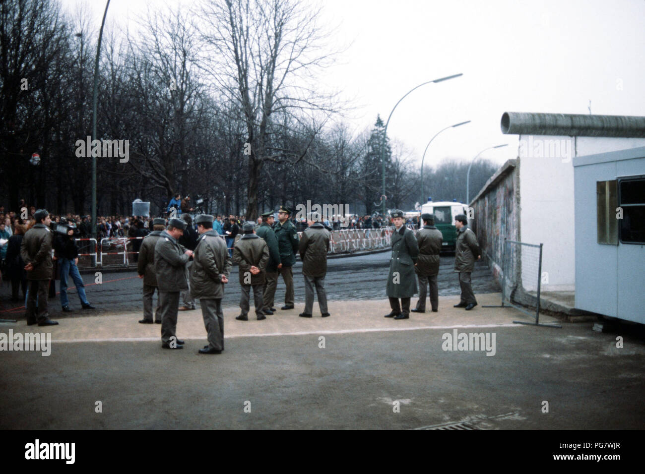 Berlin Wall 1989 - East German guards stand by the newly created ...