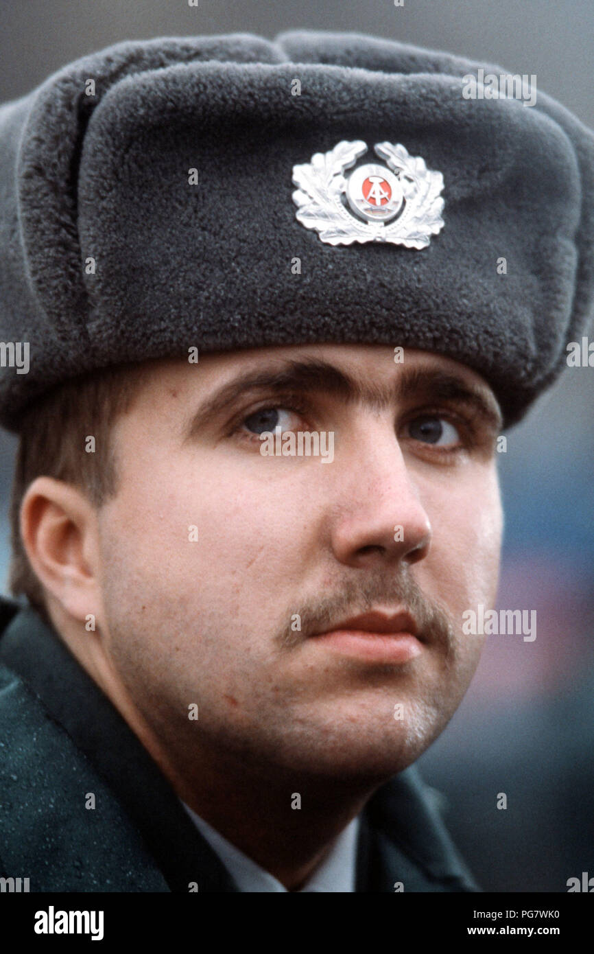 An East German guard observes activities prior to the official opening ...